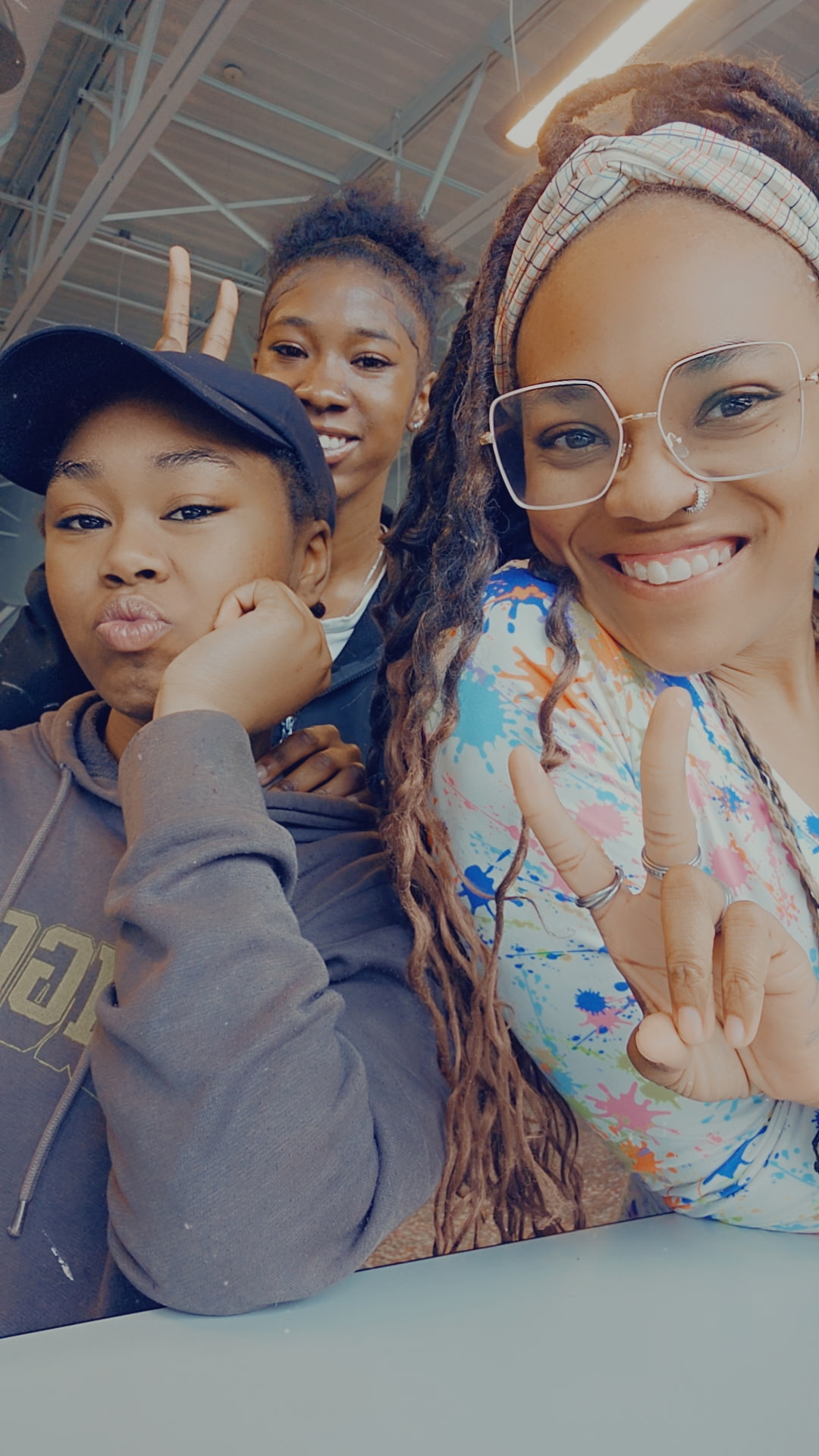 Kenisha Le'Cole with students on school bus