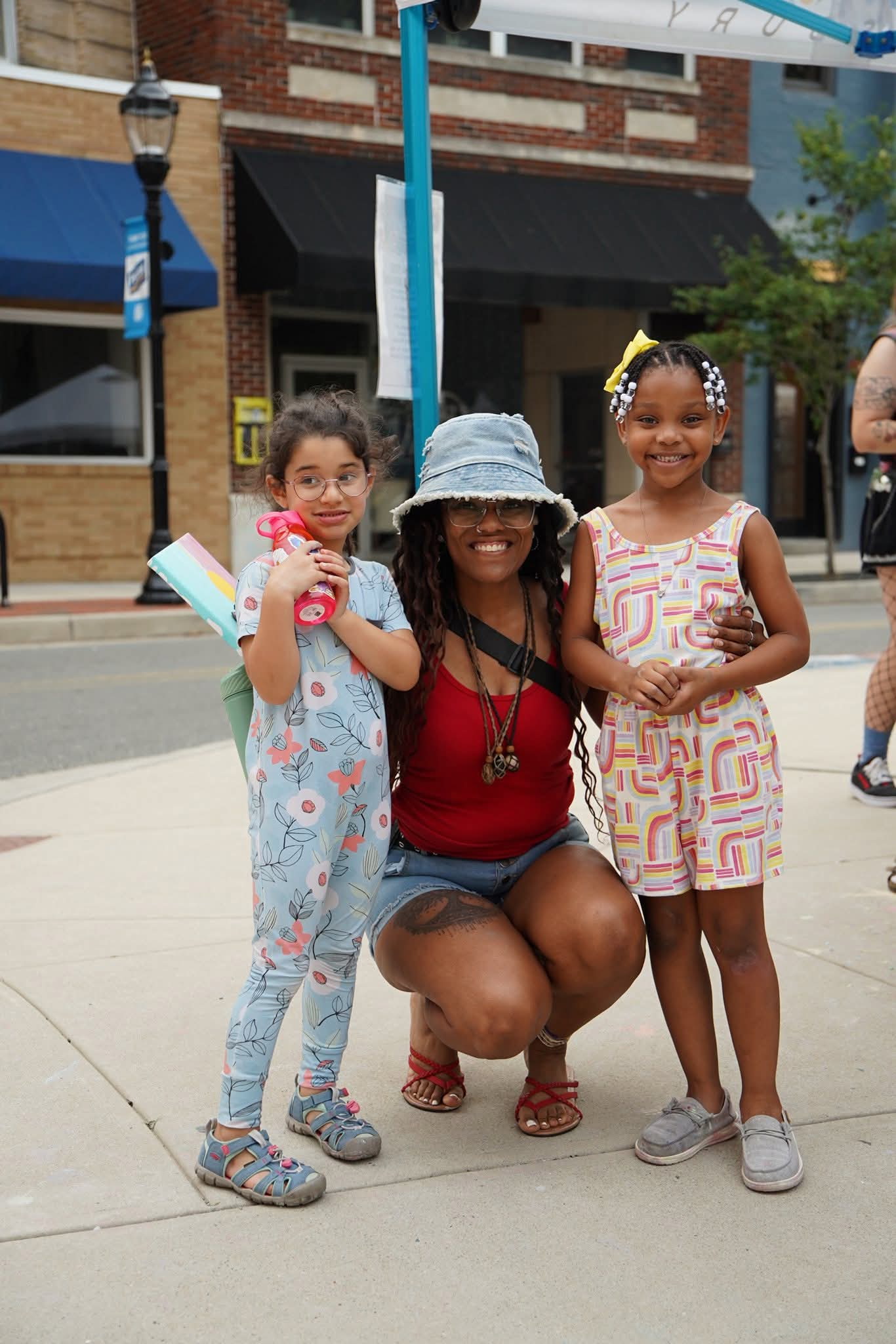 Kenisha Le'Cole with children at downtown community event